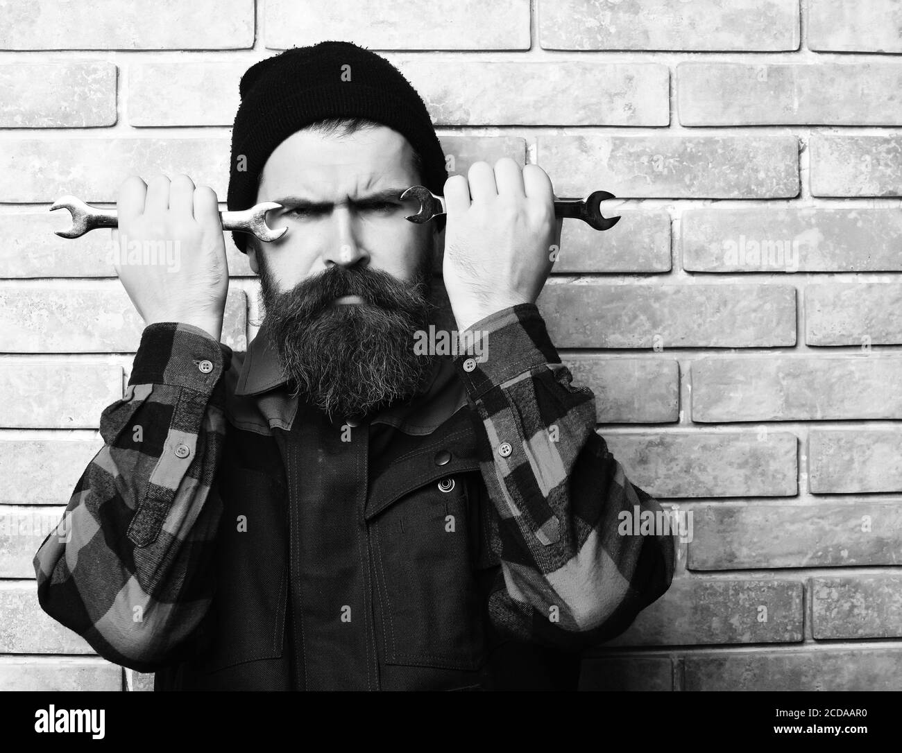 Bearded man, long beard. Brutal caucasian mechanic, unshaven hipster in ...