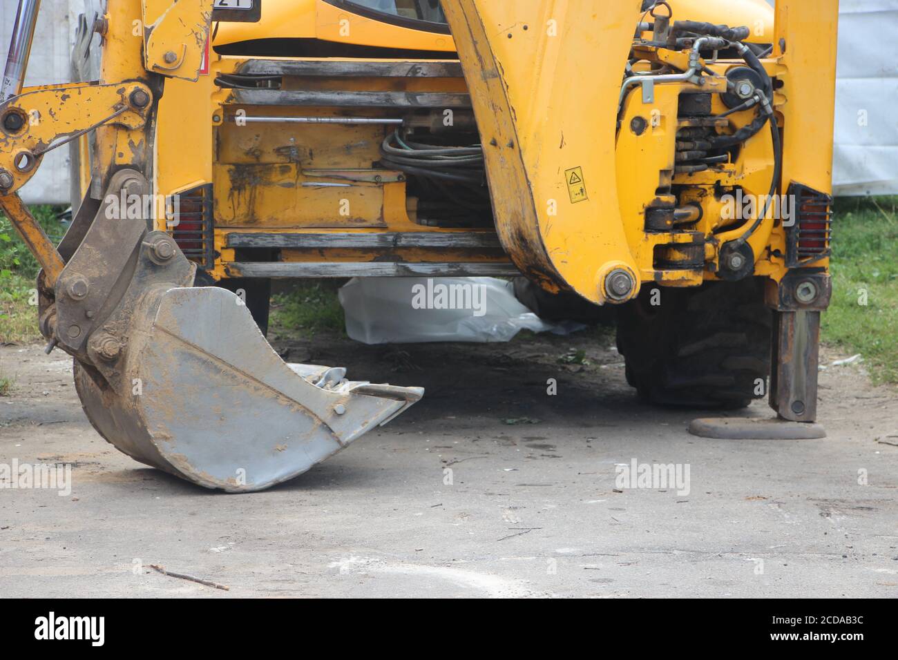 small tracked excavator to dig a hole to fix a water leak at a large ...