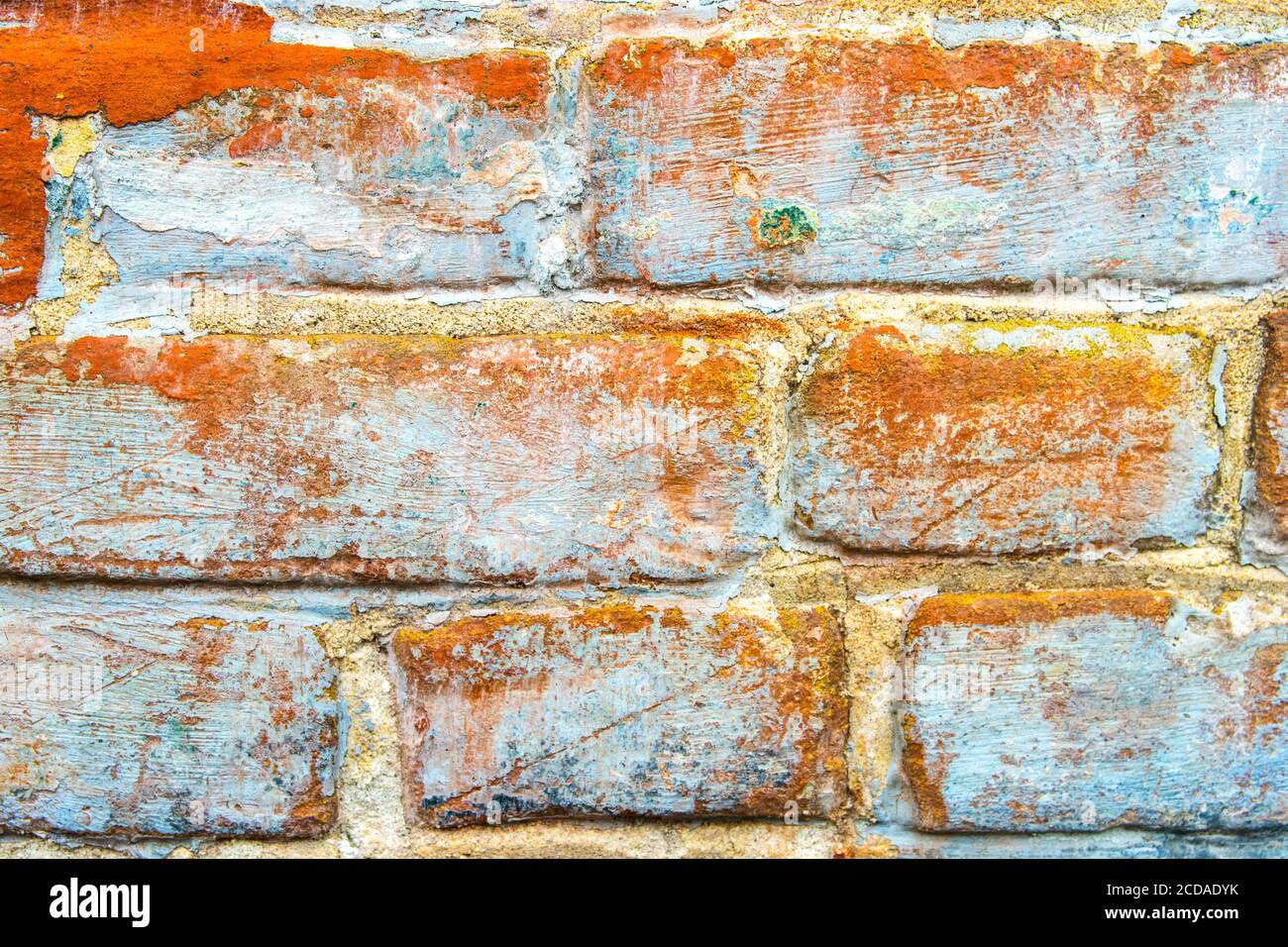 Old brick wall texture. Rough vintage wall with colorful bricks ...