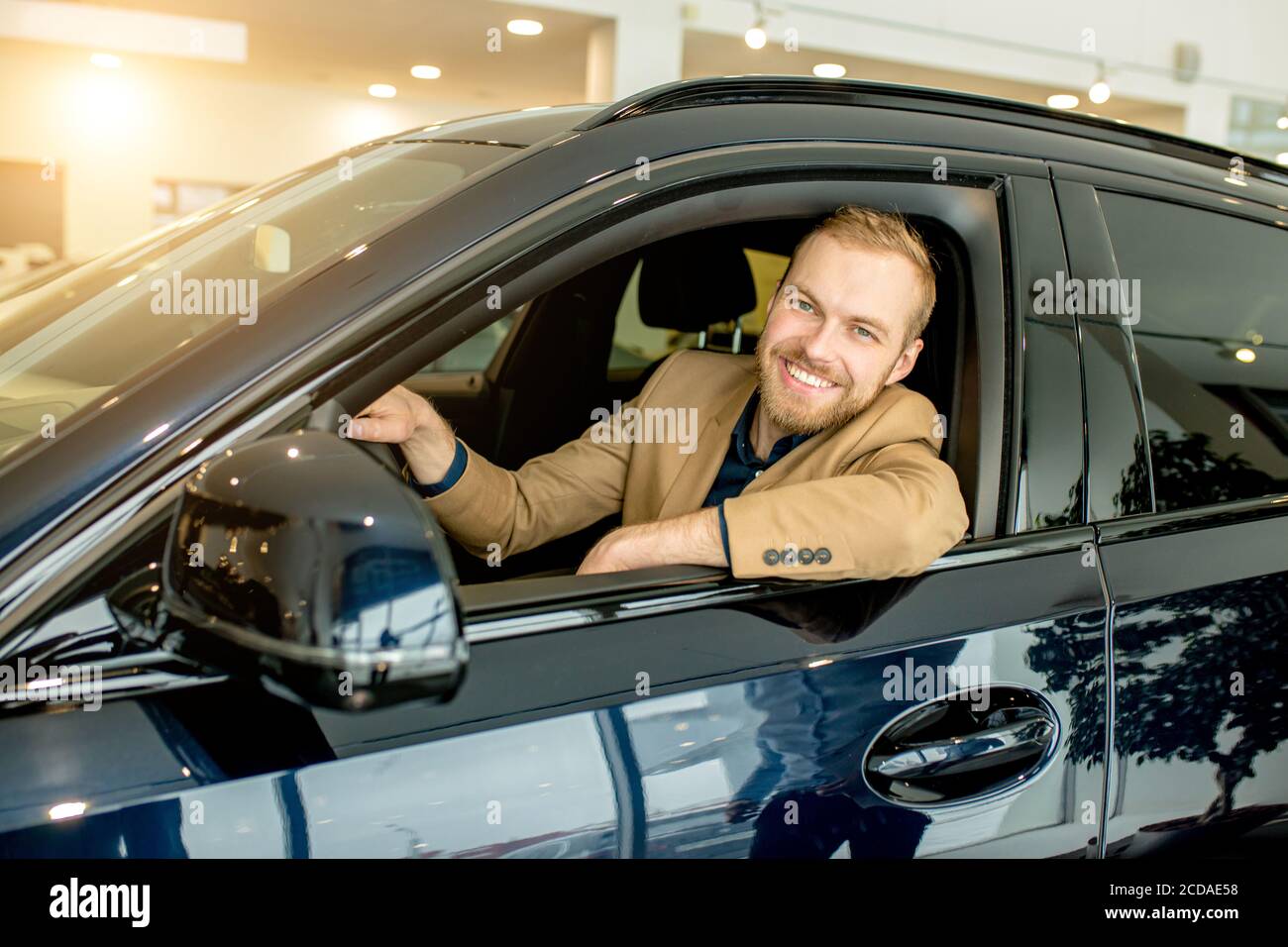 happy caucasian owner of representative auto. handsome business man ...
