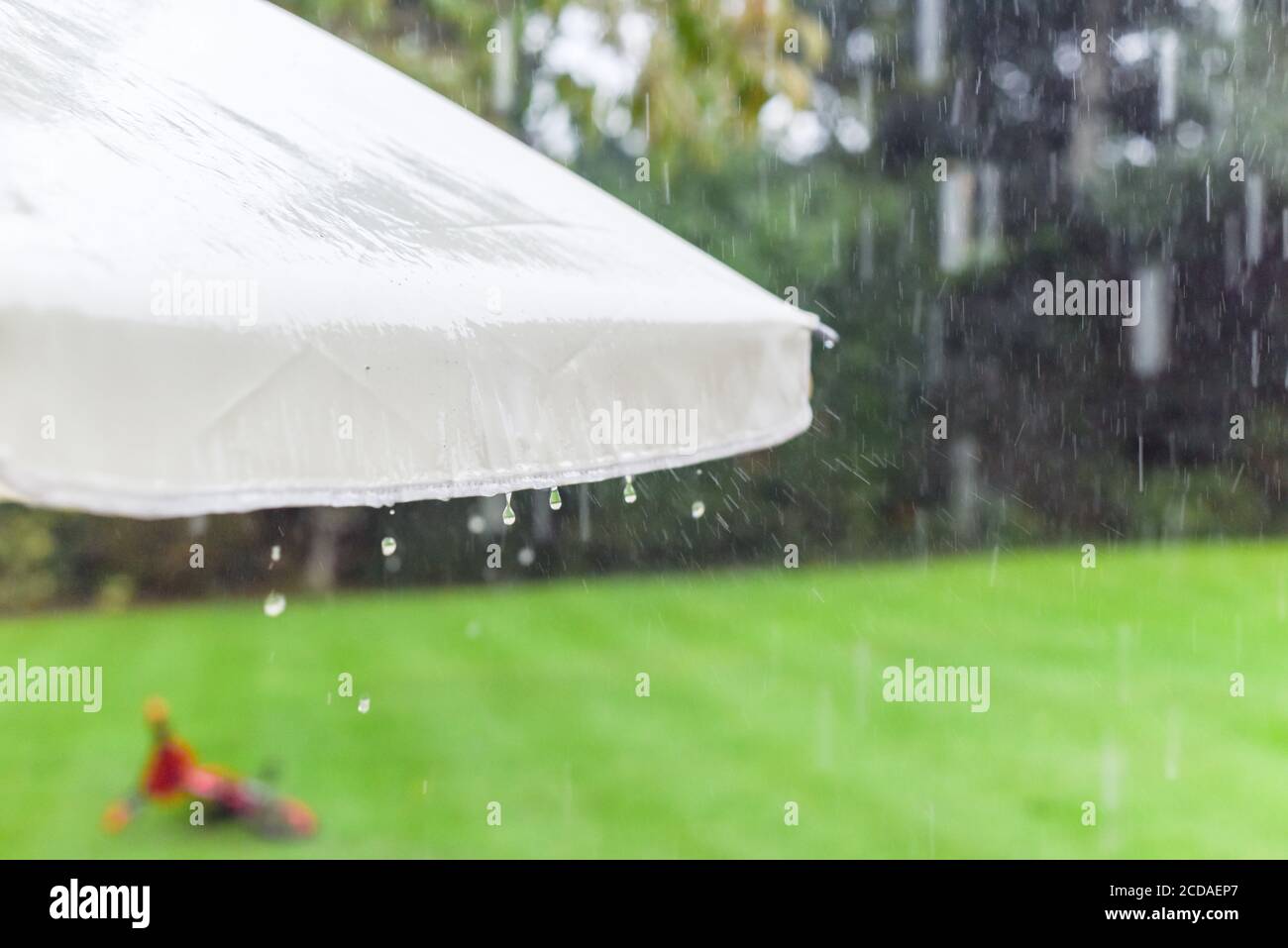 Umbrella during rainfall hi-res stock photography and images - Alamy