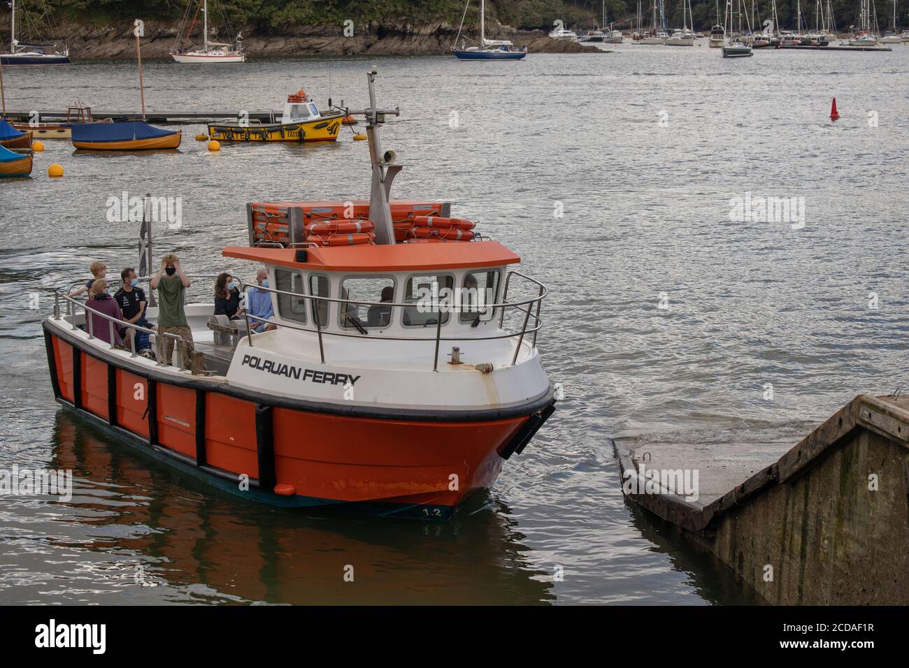 Ferry between Town Quay in Fowey and Polruan Quay on the river Fowey in ...