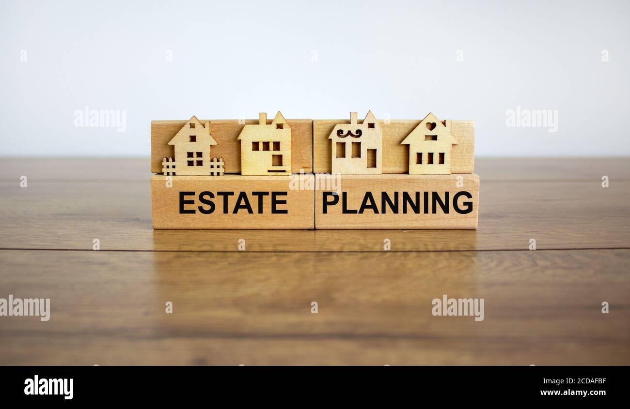 Wooden blocks form the words 'estate planning', miniature house, wooden ...