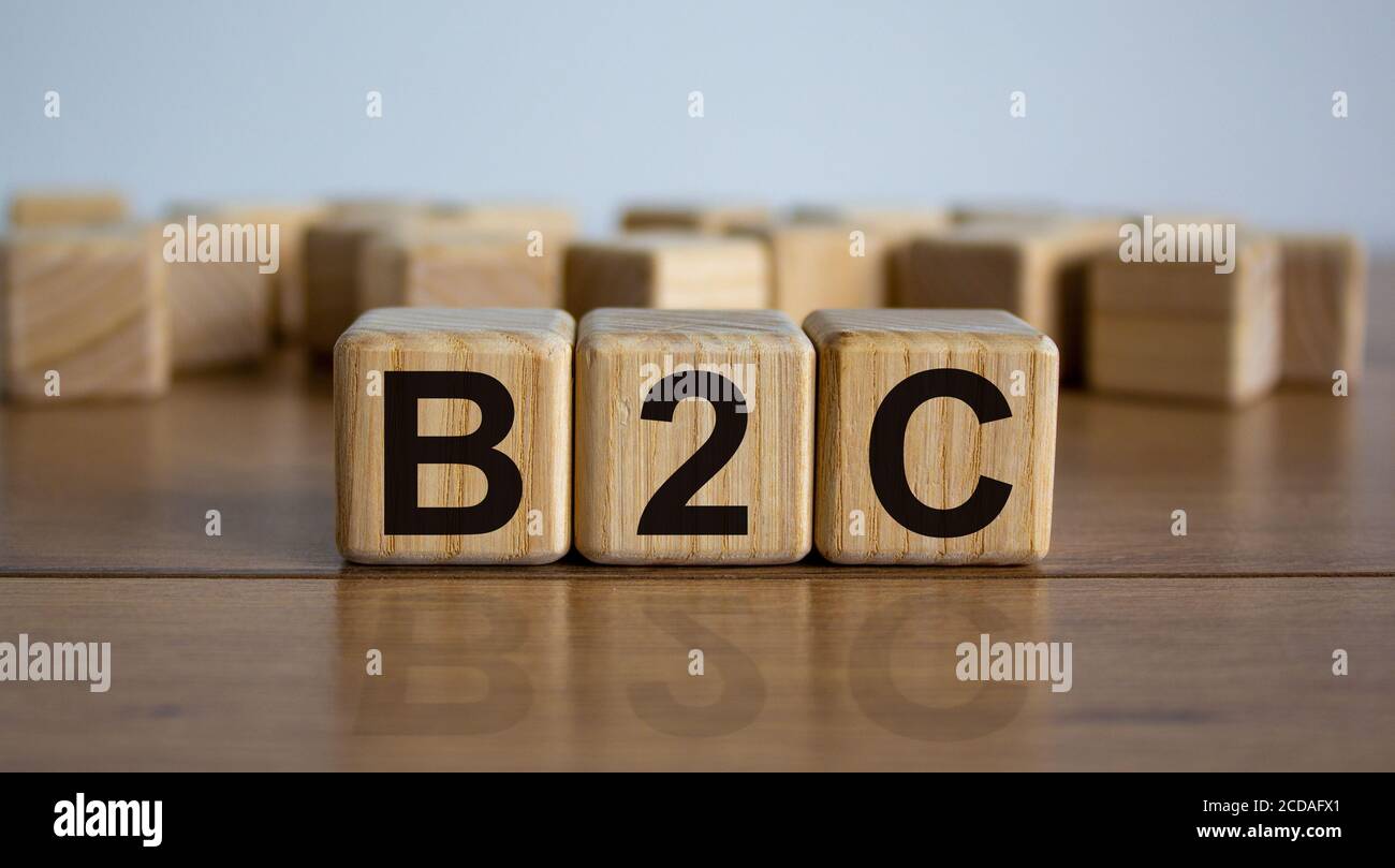 Concept word 'B2C, business to customer' on cubes on a beautiful wooden ...