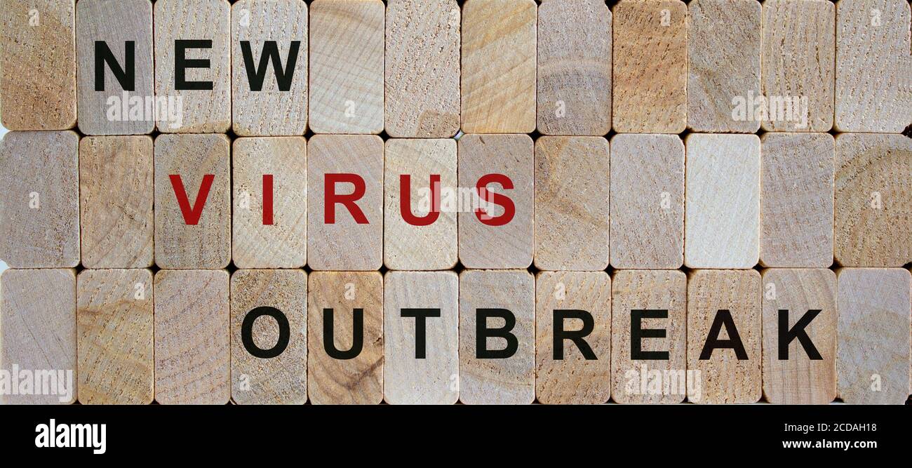 Wooden blocks form the words 'new virus outbreak'. Beautiful wooden ...
