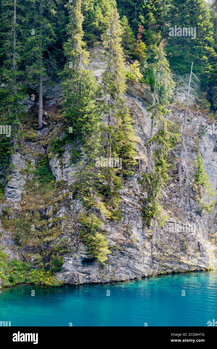 Cliff and blue turquoise water on Saint Gerin lake, Alps, France Stock ...