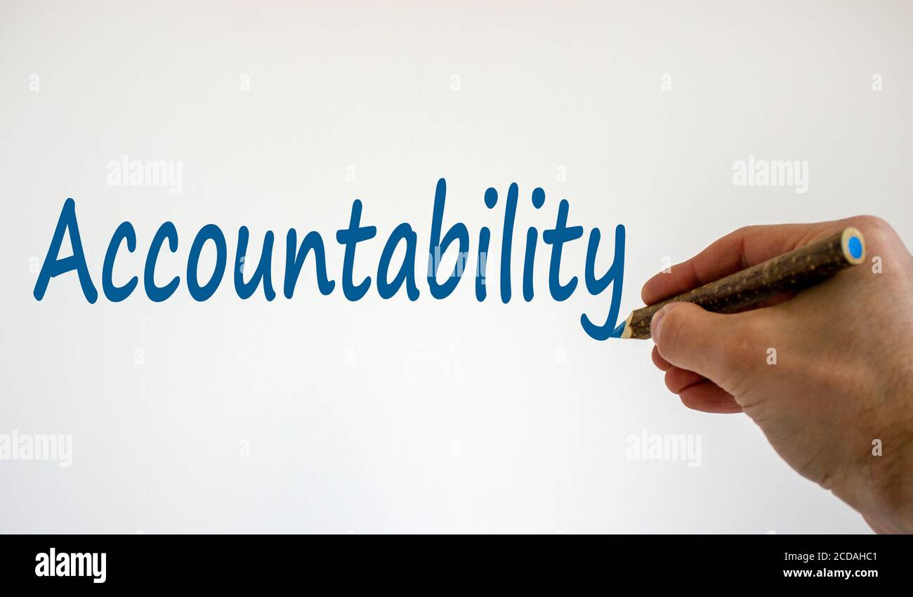 Hand writing 'accountability', isolated on beautiful white background ...