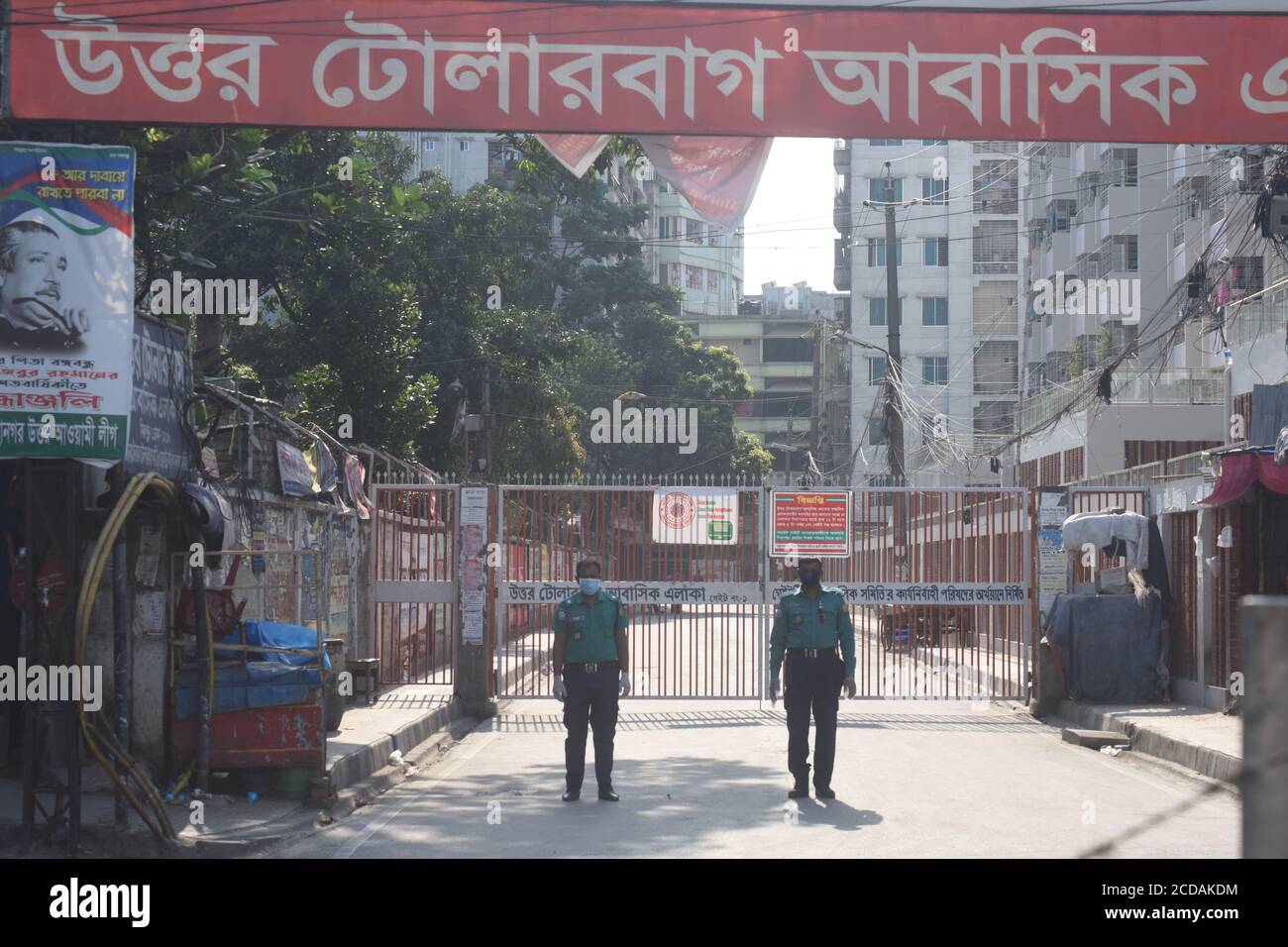 Members of the Bangladesh Police stands guard in front of a locked down ...