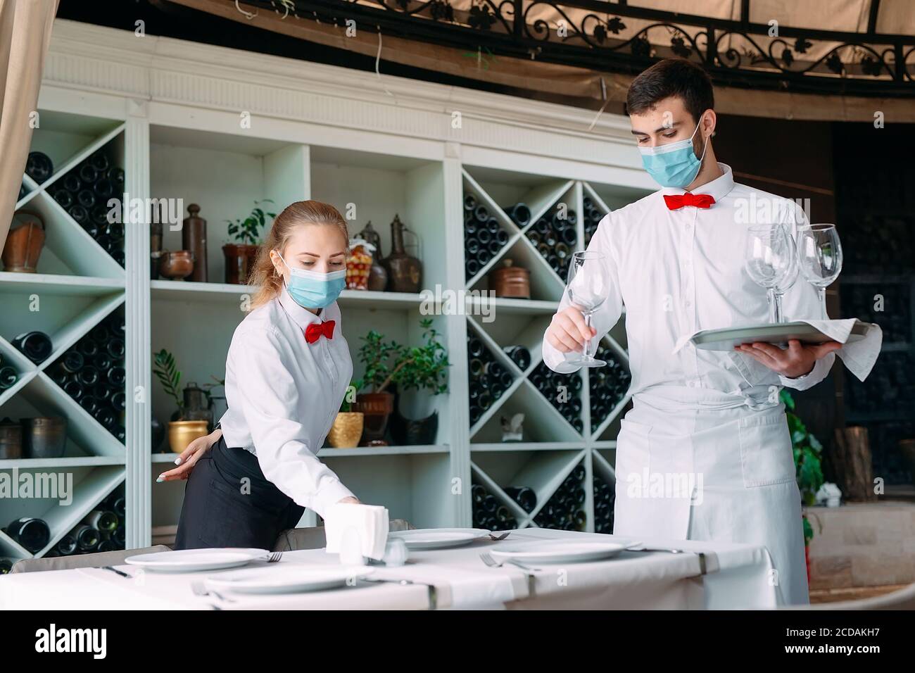 Table setting restaurant waiter mask hi-res stock photography and ...