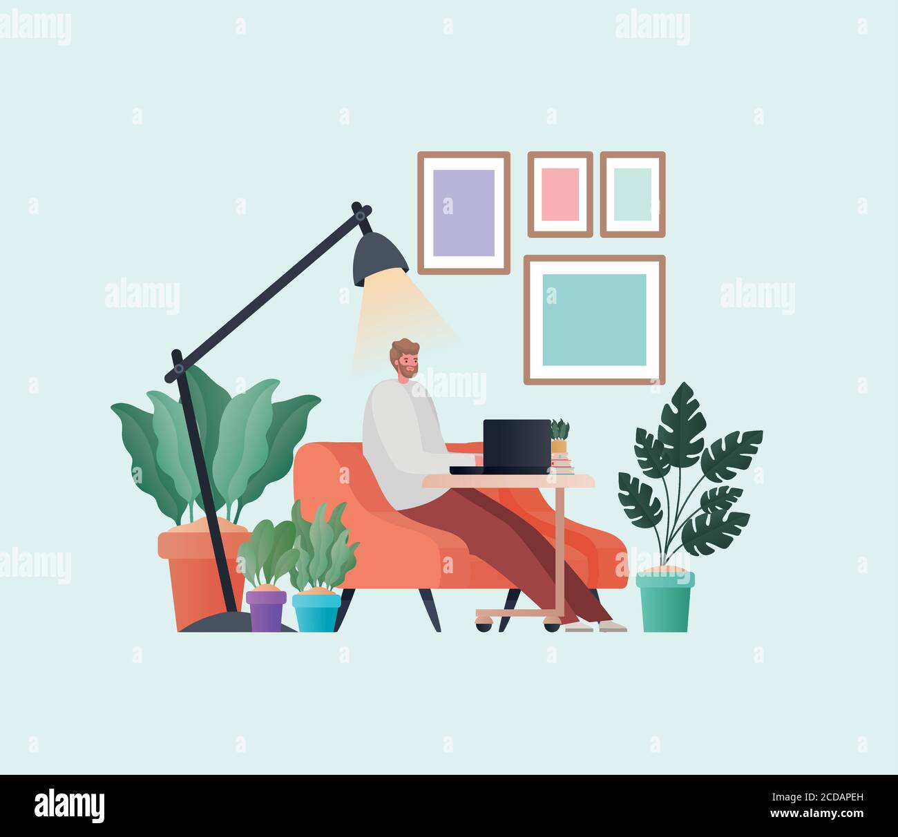Man with laptop working on orange couch design of Work from home theme ...
