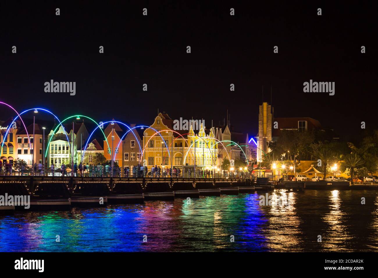 Night view of the Queen Emma Bridge, a swinging pontoon bridge ...
