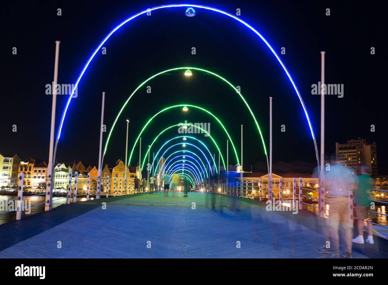 Night view of the Queen Emma Bridge, a swinging pontoon bridge ...