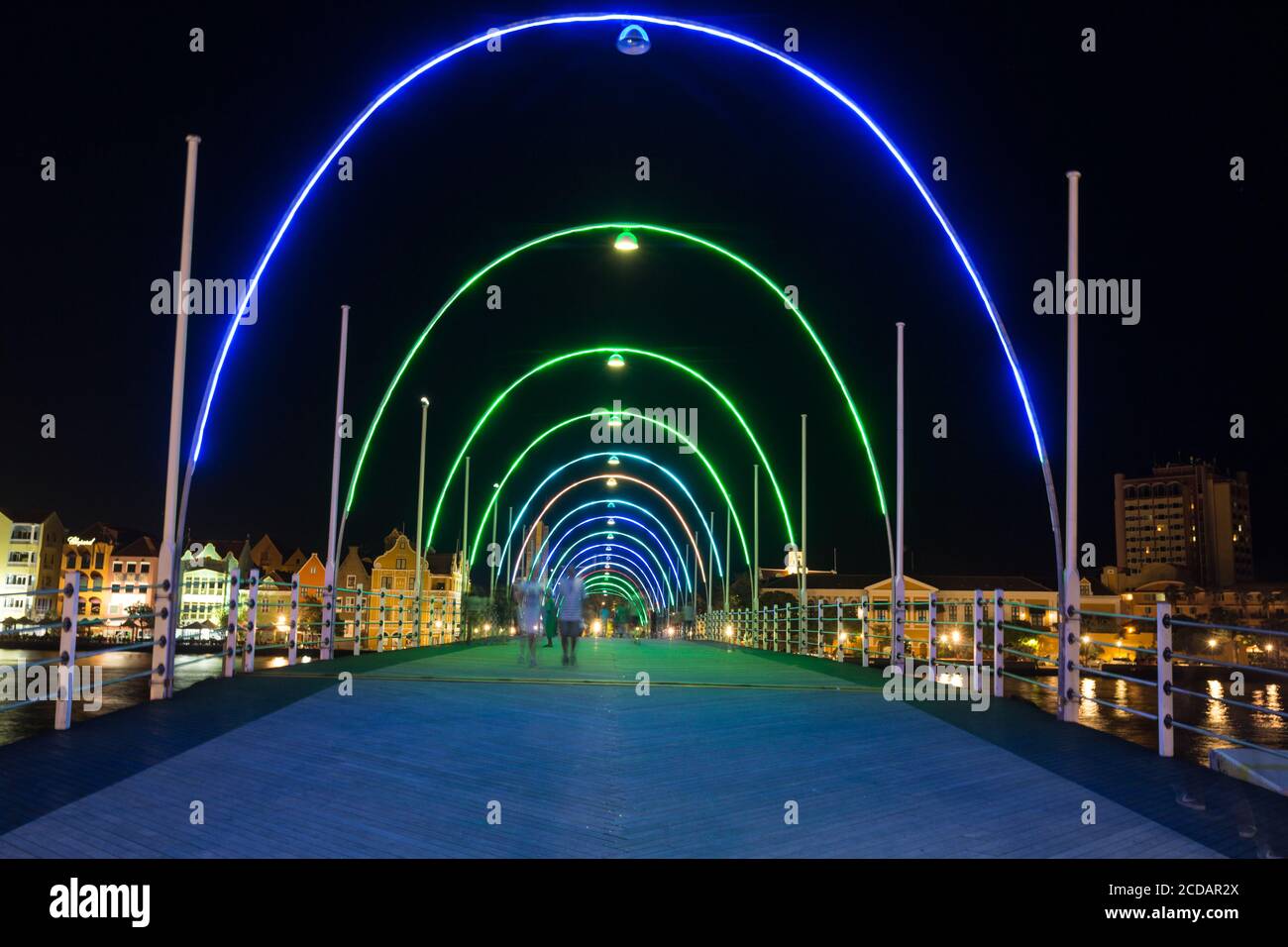 Night view of the Queen Emma Bridge, a swinging pontoon bridge ...