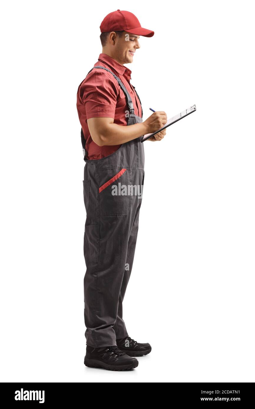 Full length profile shot of a male worker writing a document isolated ...