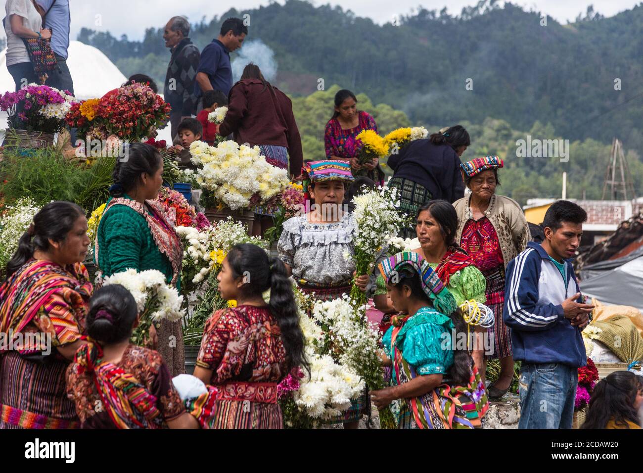 Quiche Mayan women sell flowers in the flower market on the pre ...