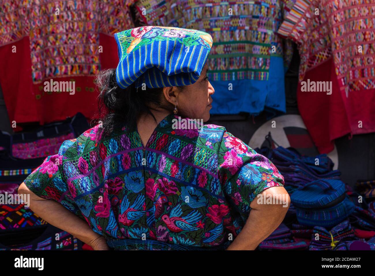 A Quiche Mayan woman in traditional dress and tzute cloth on her head ...