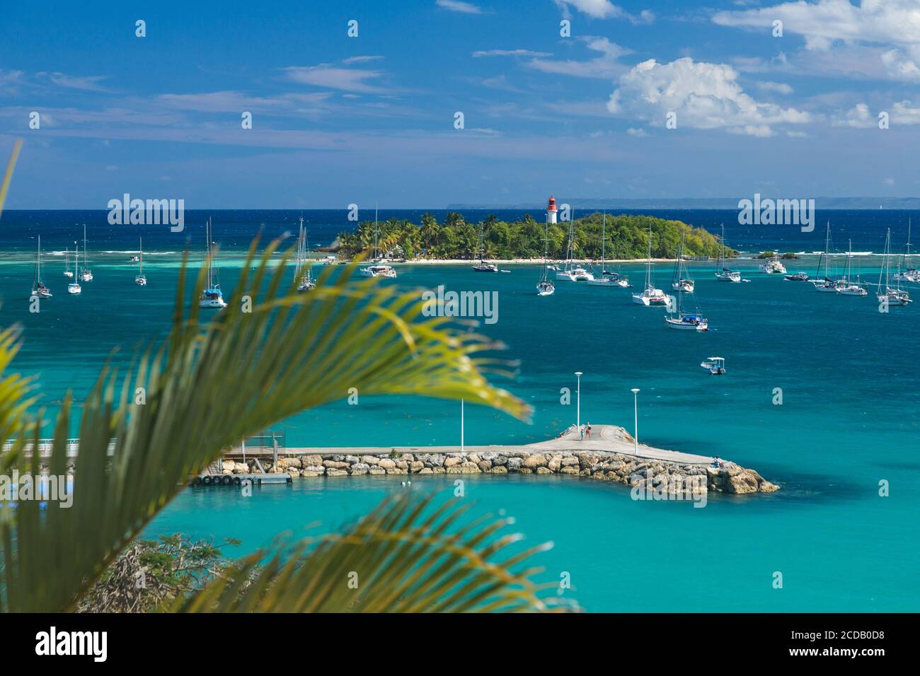 Sailboats at anchor by the Ilet Du Gosier Lighthouse as seen from ...