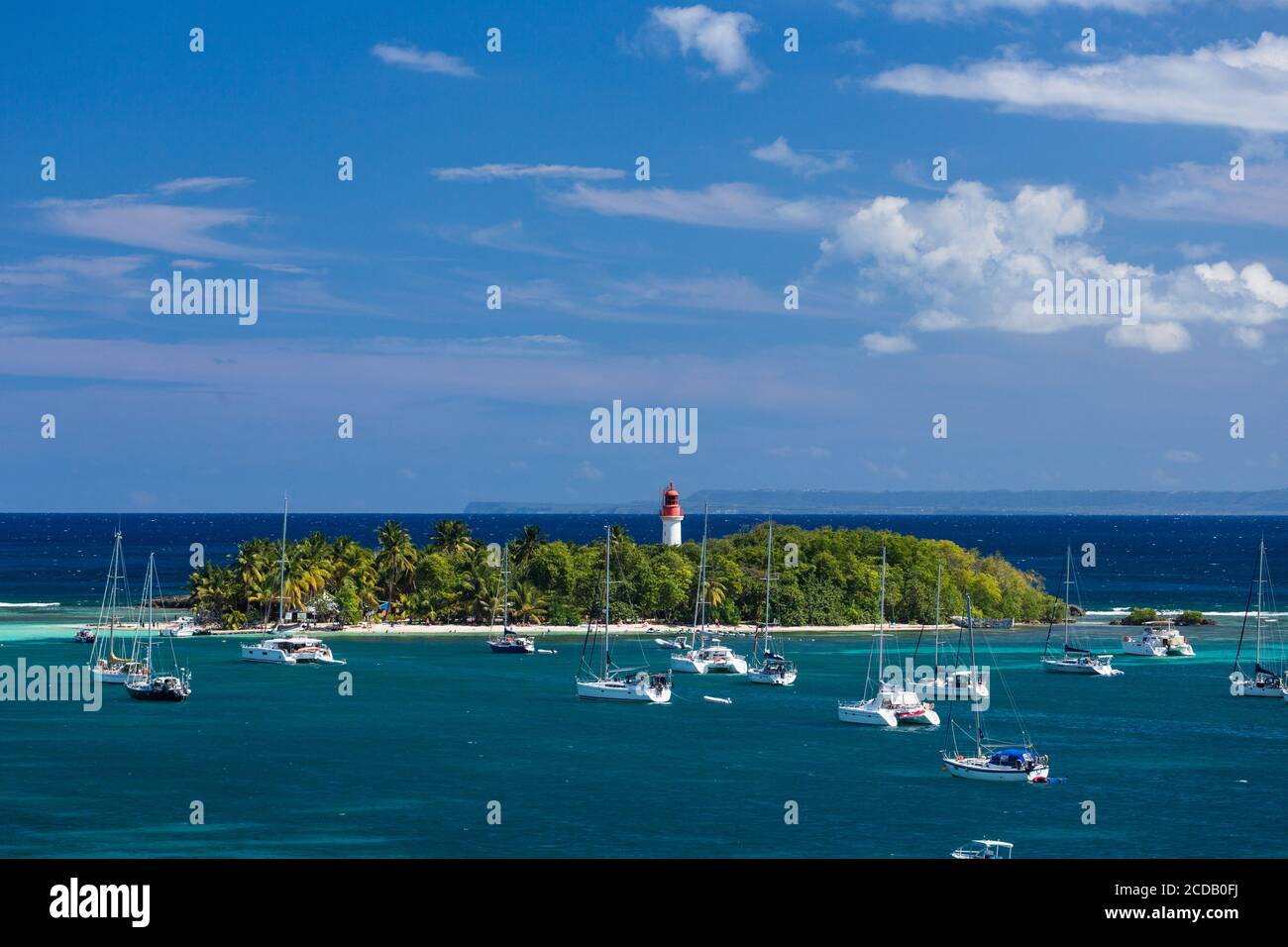 Sailboats at anchor by the Ilet Du Gosier Lighthouse as seen from ...