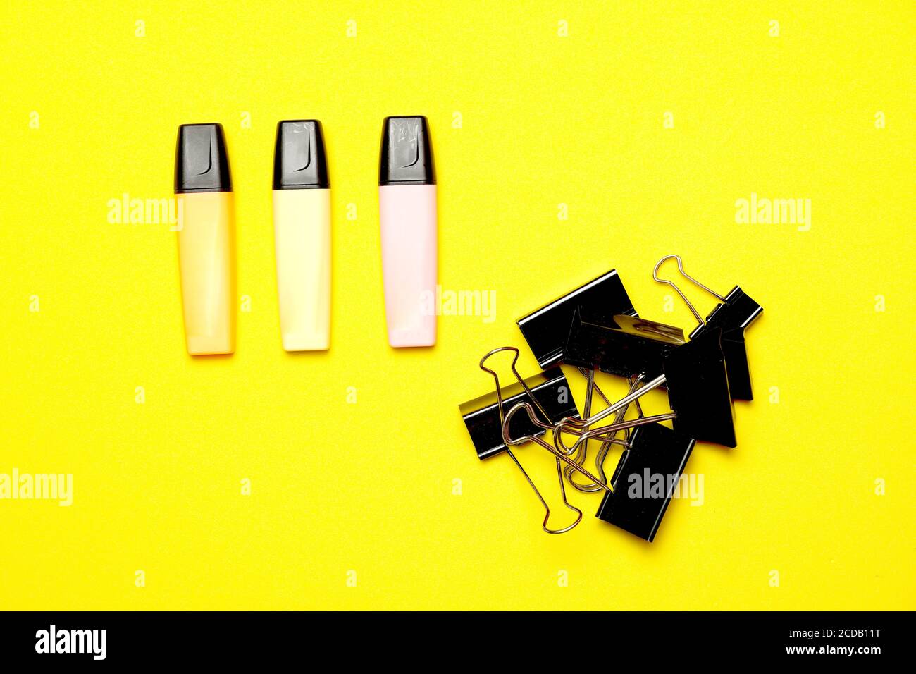 top view of office work items. colored markers and clips. office or ...