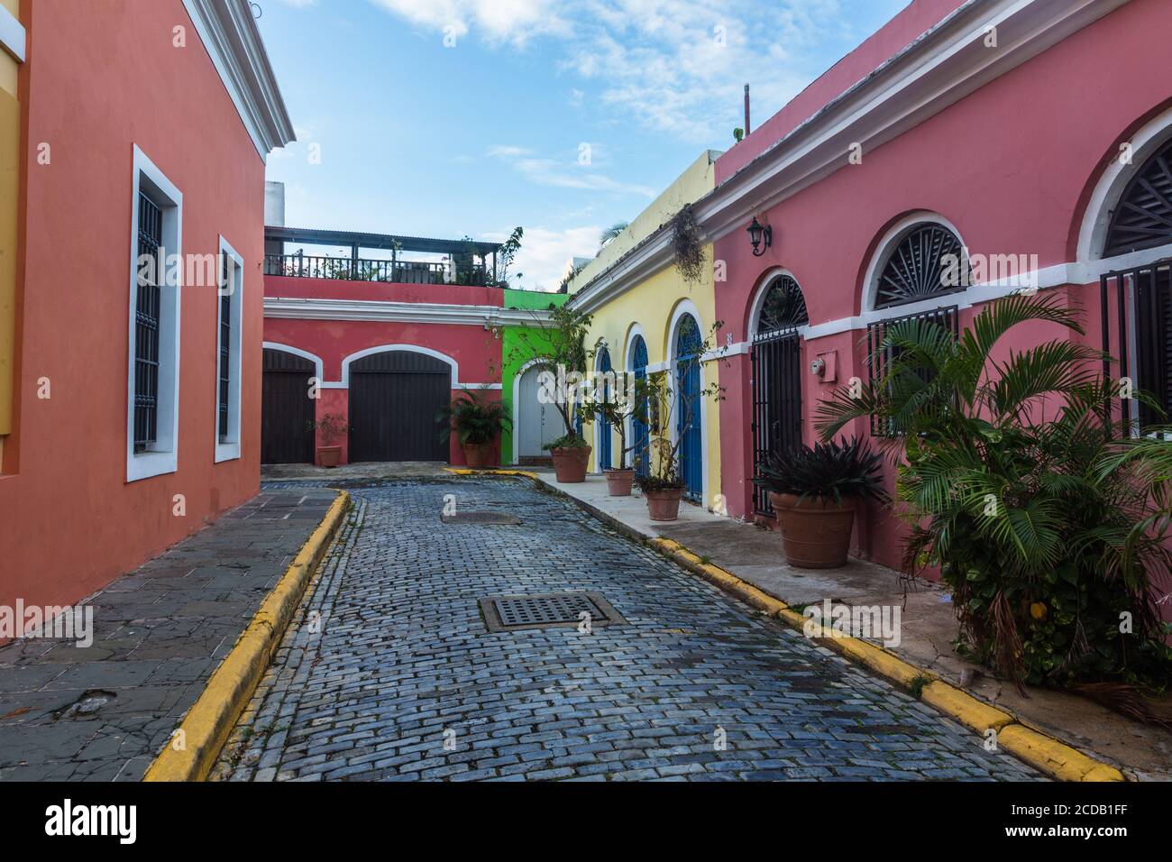 Colorfully painted houses on a narrow cobblestone street in the ...