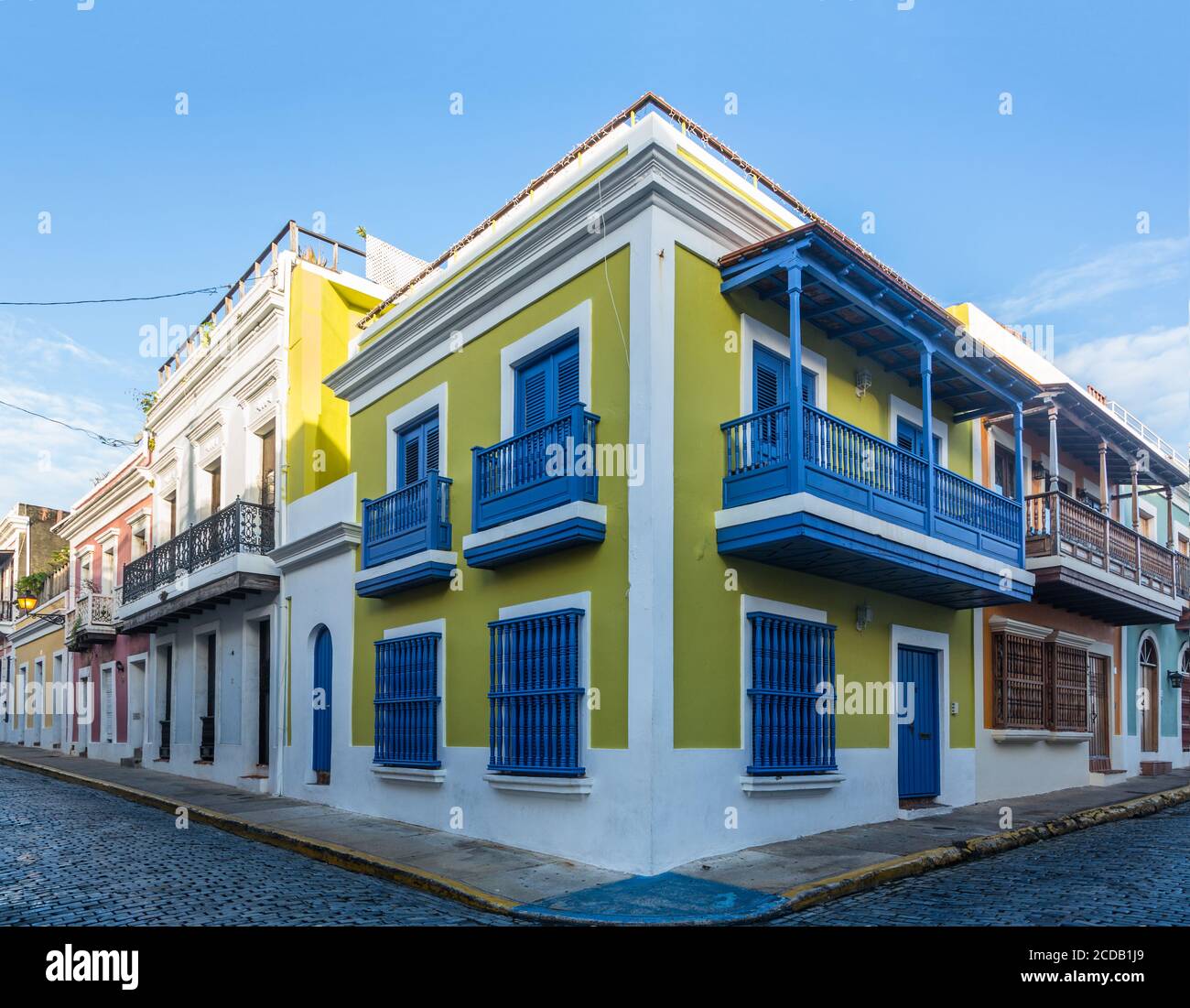 Colorfully painted houses on a narrow cobblestone street in the ...