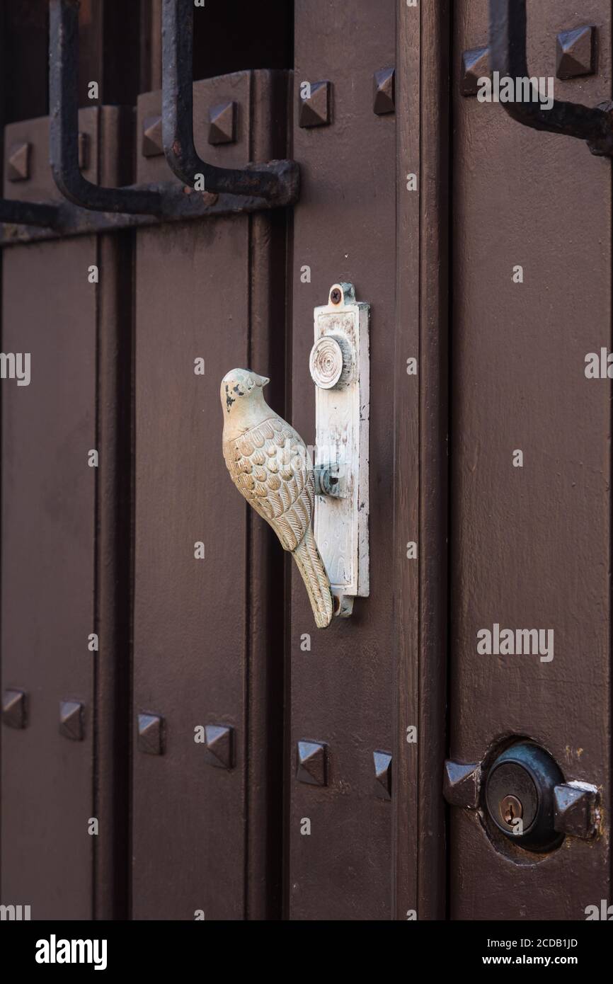 Cast bronze door knocker in the shape of a bird in the historic ...