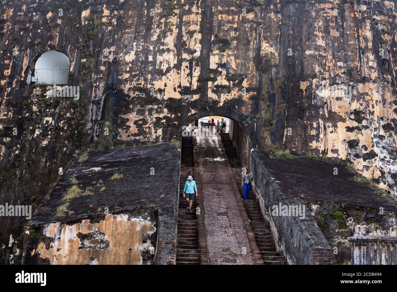 Two tourists walk down the stairs between the Main and Lower Plazas in ...