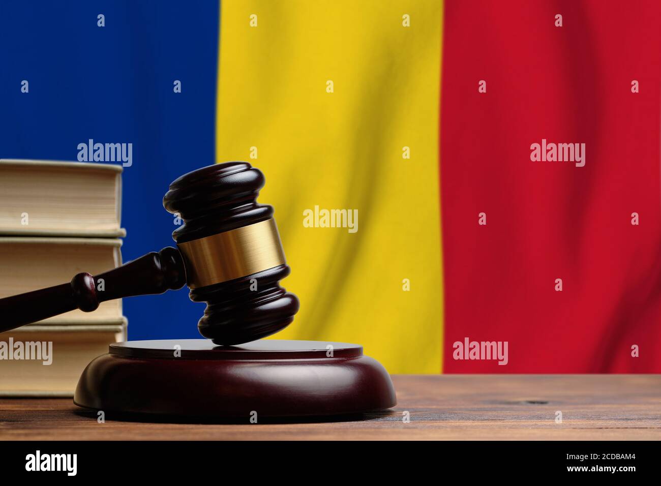 Justice and court concept in Romania. Judge hammer on a flag background ...