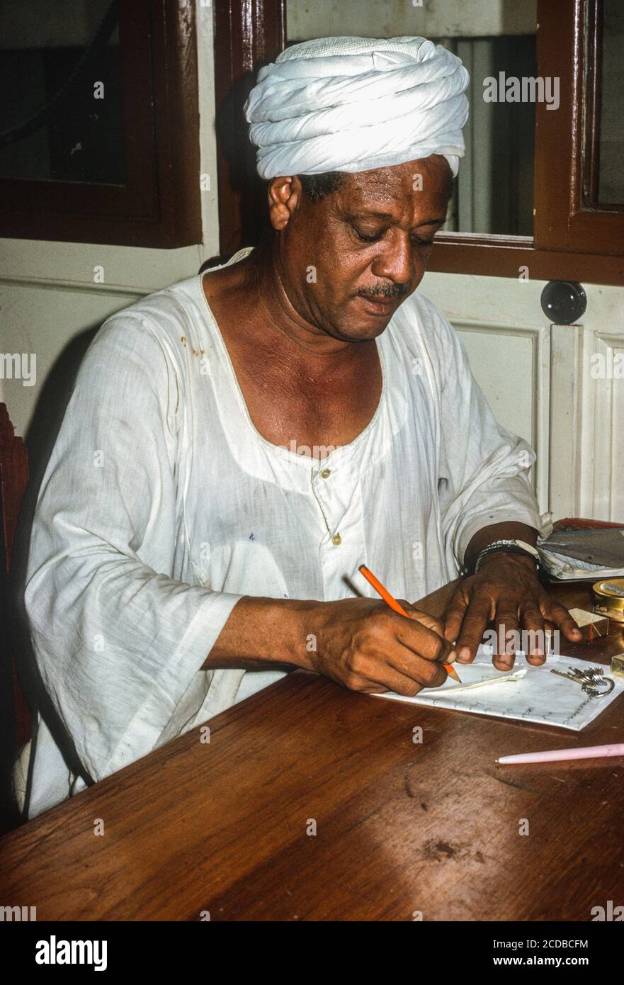 Sudanese Boat Crew Member Writing, White Nile, South Sudan Stock Photo ...