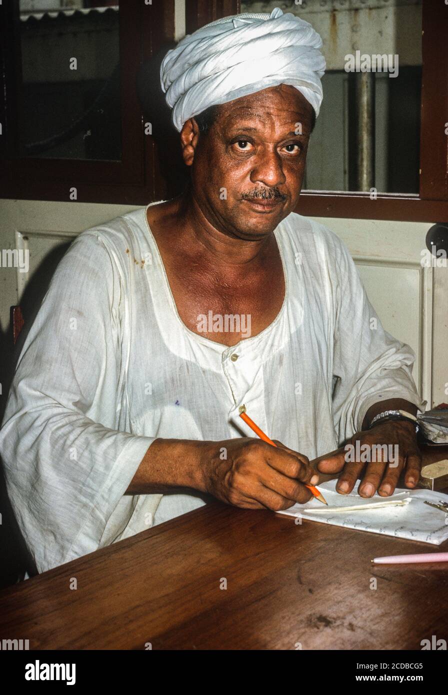 Sudanese Boat Crew Member Writing, White Nile, South Sudan Stock Photo ...