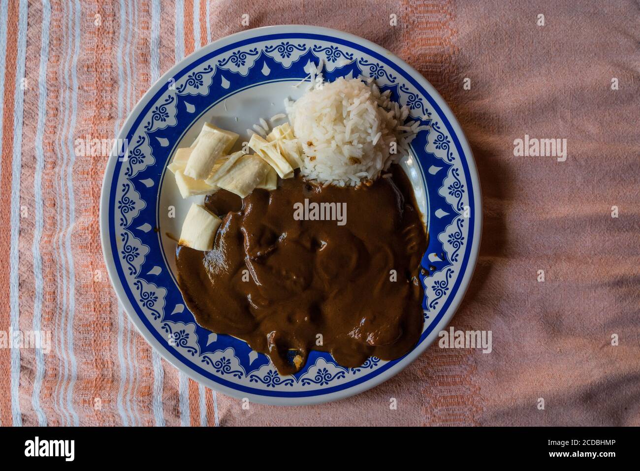 Chicken with coloradito mole sauce, rice, and quesillo or Oaxacan ...