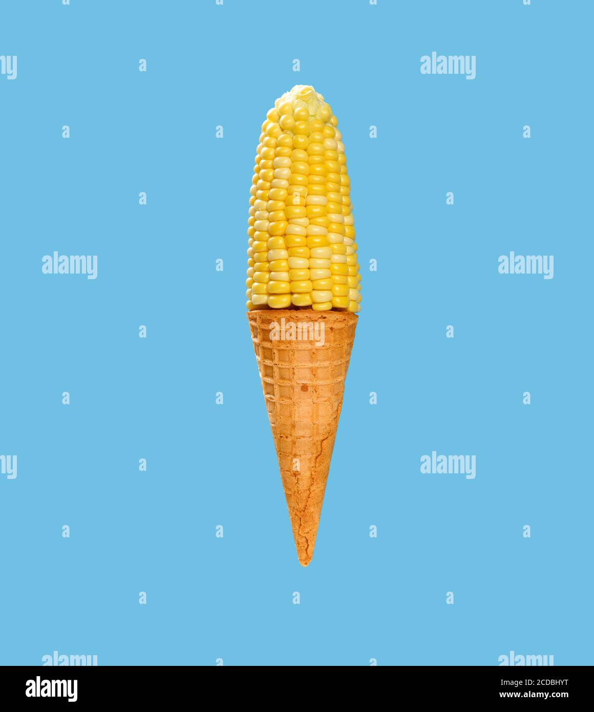 maize and an empty cone shaped like an ice cream cone on blue ...