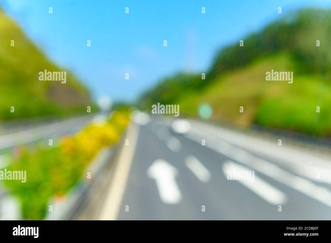 out focus highway lanes with arrows as background Stock Photo - Alamy