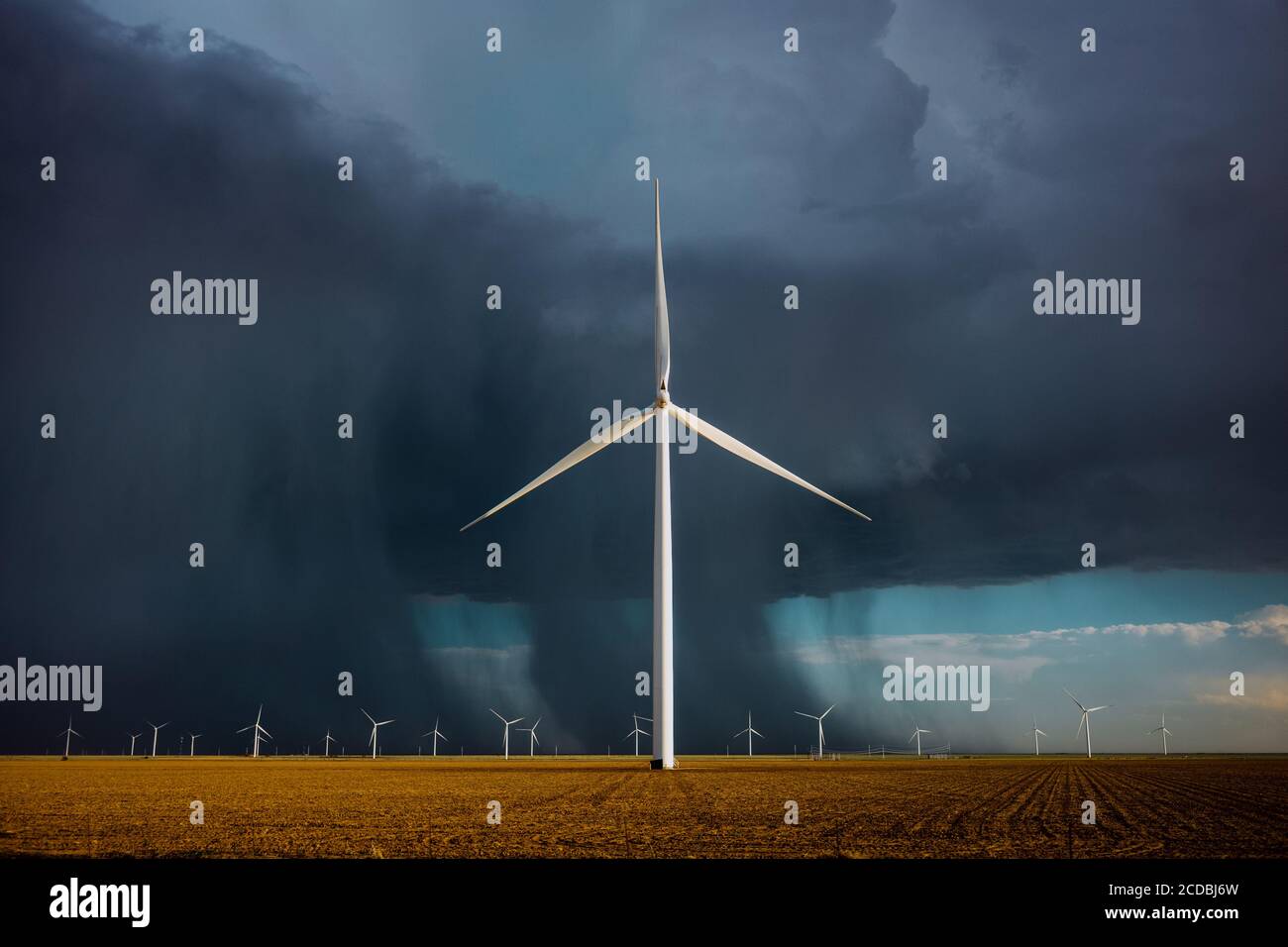 Wind farm with dramatic epic thunderstorm rain clouds Stock Photo - Alamy