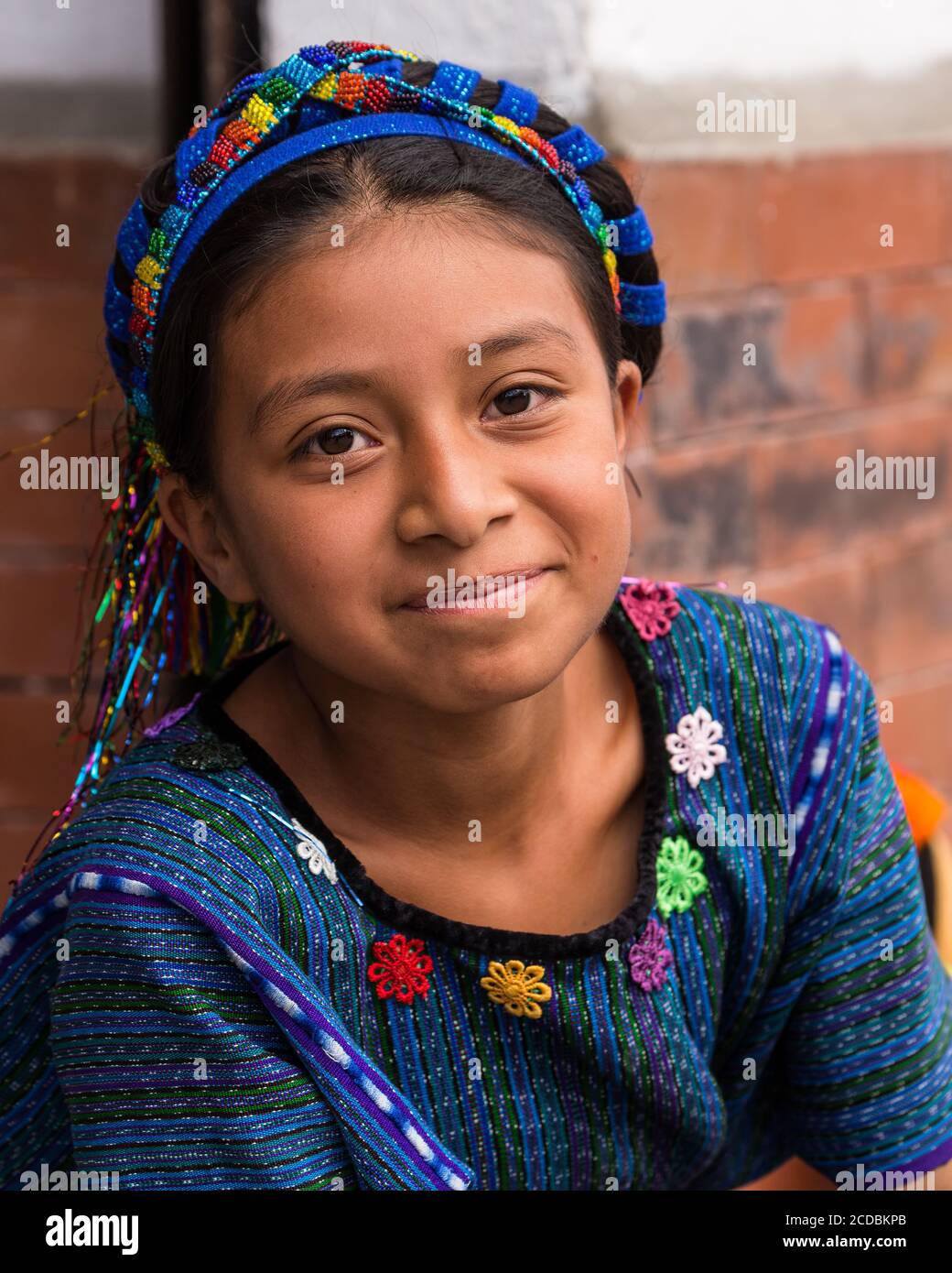 A young Cakchiquel Mayan girl in the traditional dress of San Antonio ...