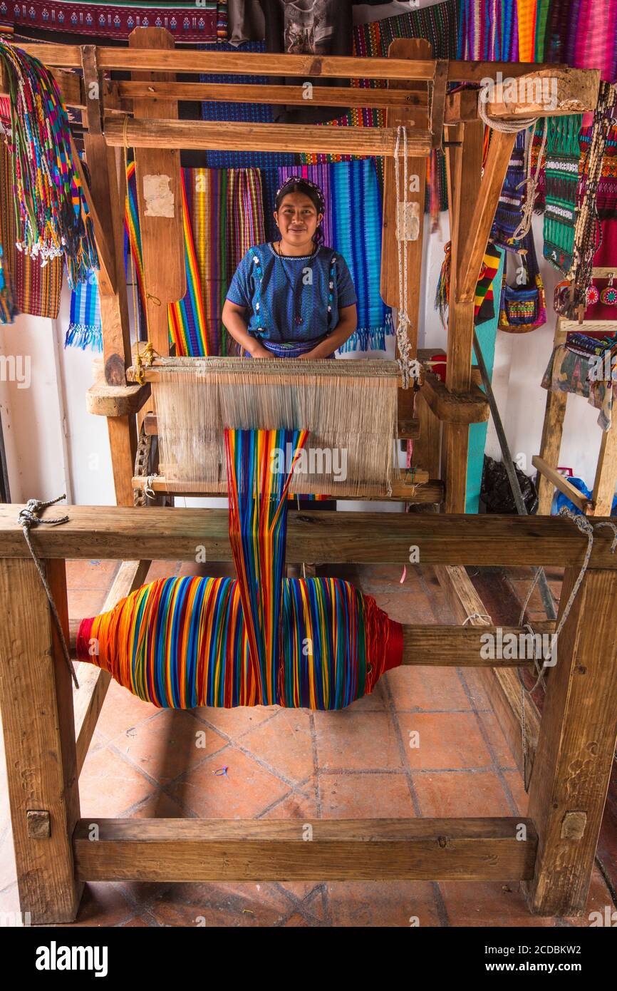 Female weaver working on a hand operated loom hi-res stock photography ...