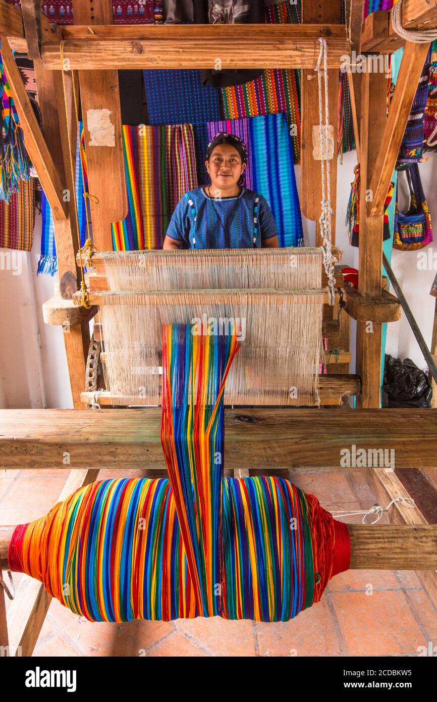 Female weaver working on a hand operated loom hi-res stock photography ...