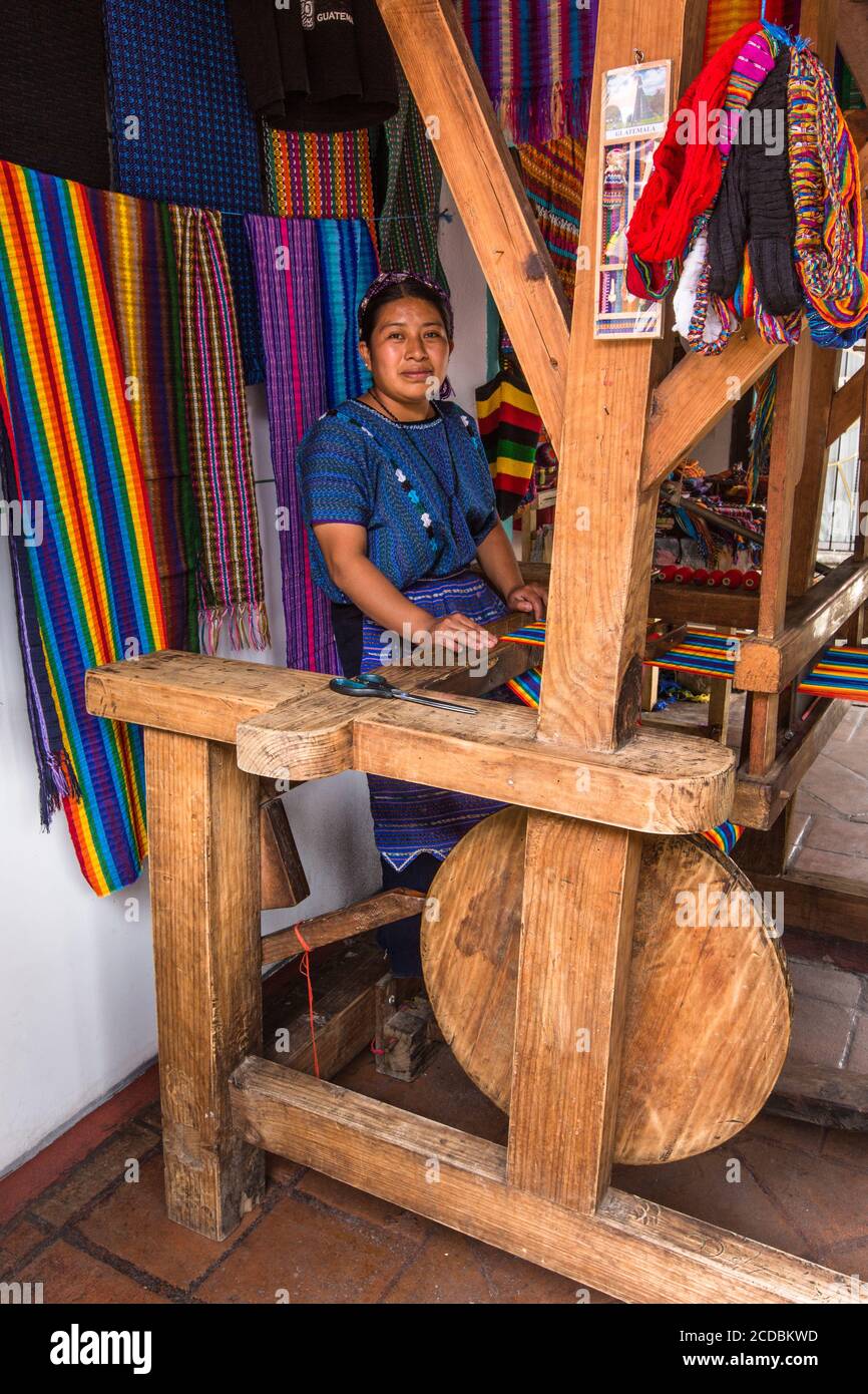 Female weaver working on a hand operated loom hi-res stock photography ...