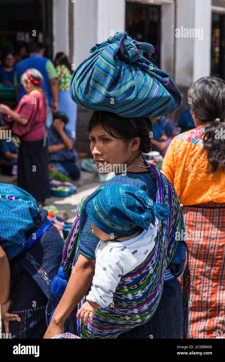 A young Mayan woman in the traditional dress from San Antonio Palopó ...