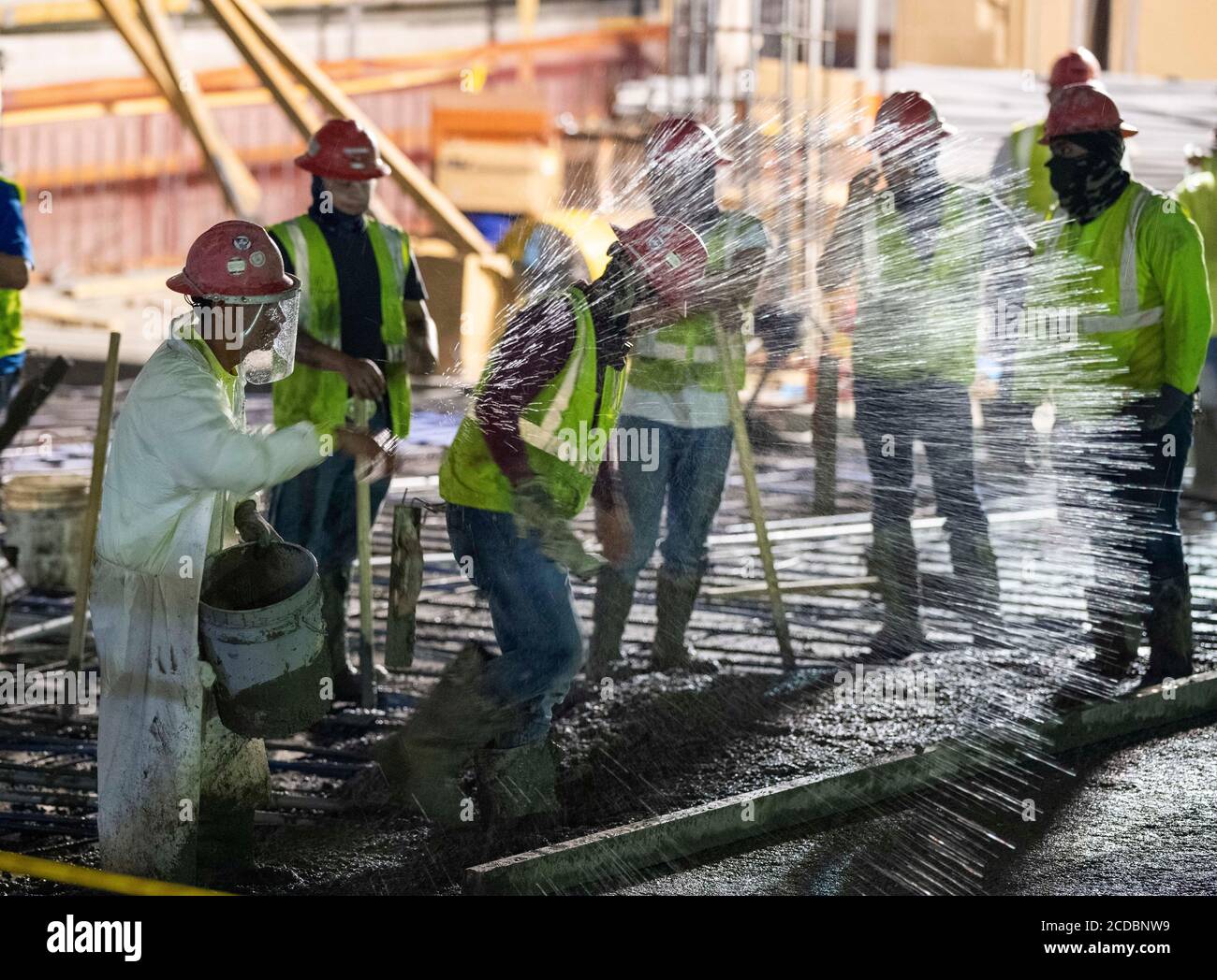 Crew construction workers pour concrete hi-res stock photography and ...