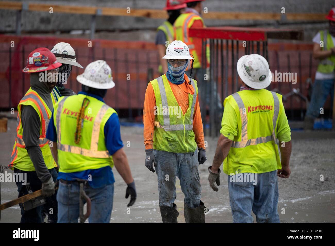 Crew construction workers pour concrete hi-res stock photography and ...