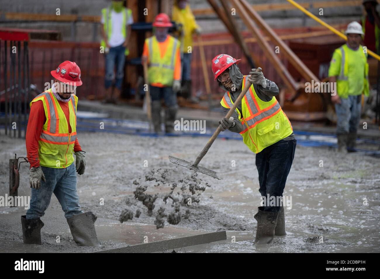 Crew construction workers pour concrete hi-res stock photography and ...