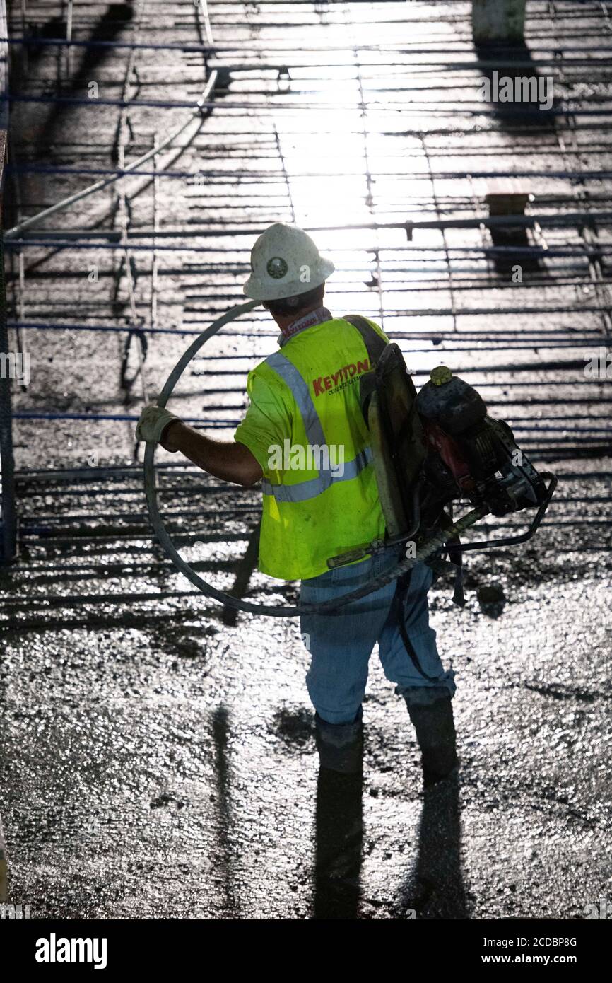 Crew construction workers pour concrete hi-res stock photography and ...