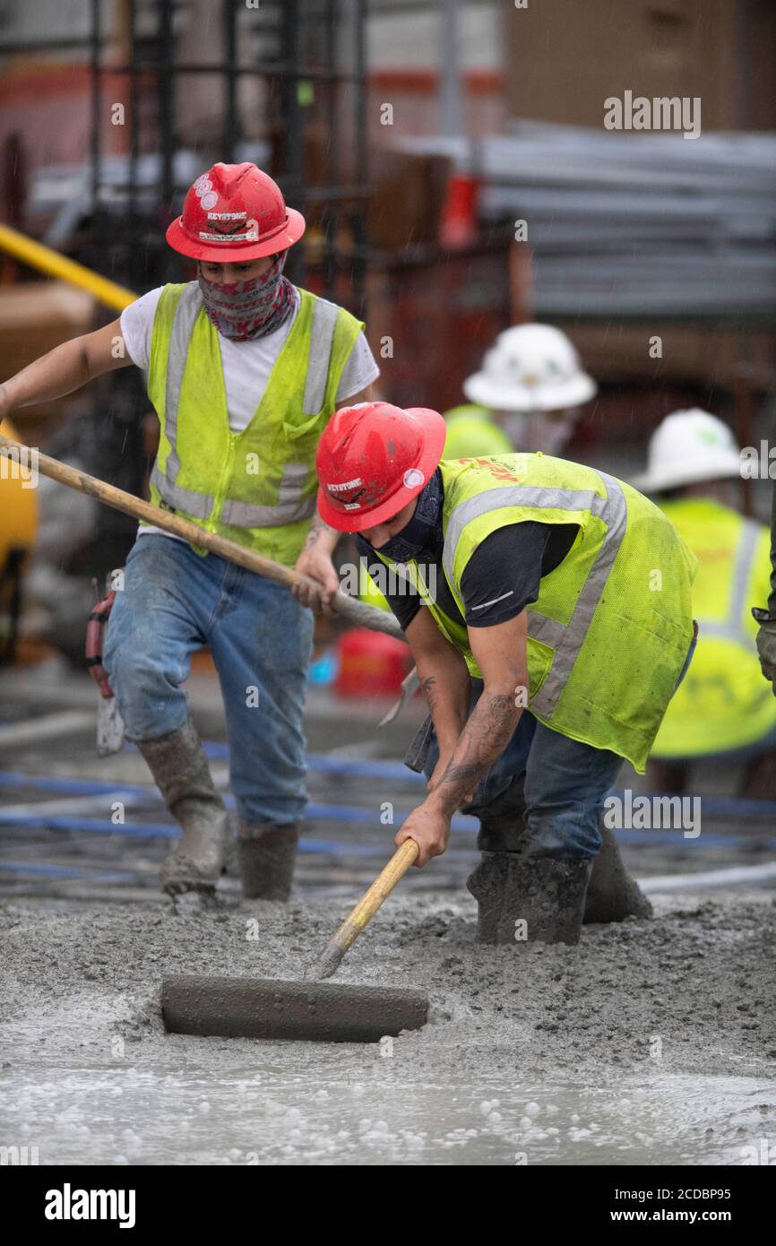 Crew construction workers pour concrete hi-res stock photography and ...