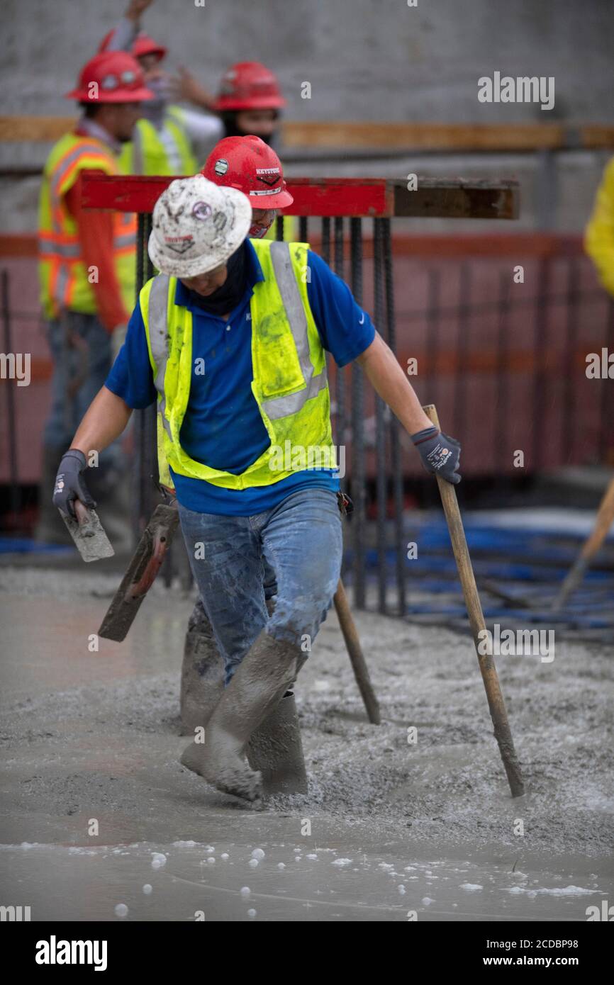 Crew construction workers pour concrete hi-res stock photography and ...