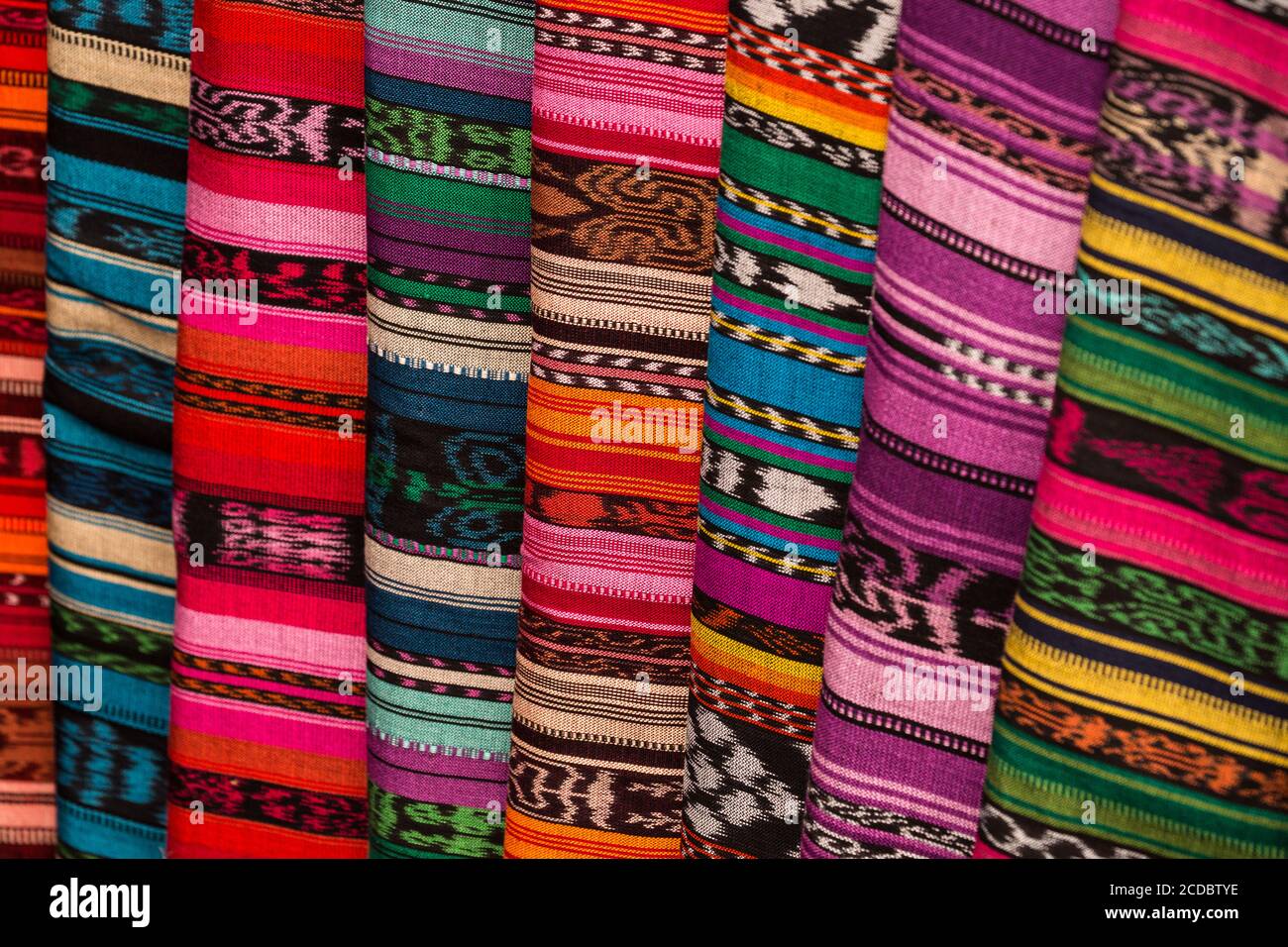 A display of tzutes or traditional utility cloths for sale in the ...