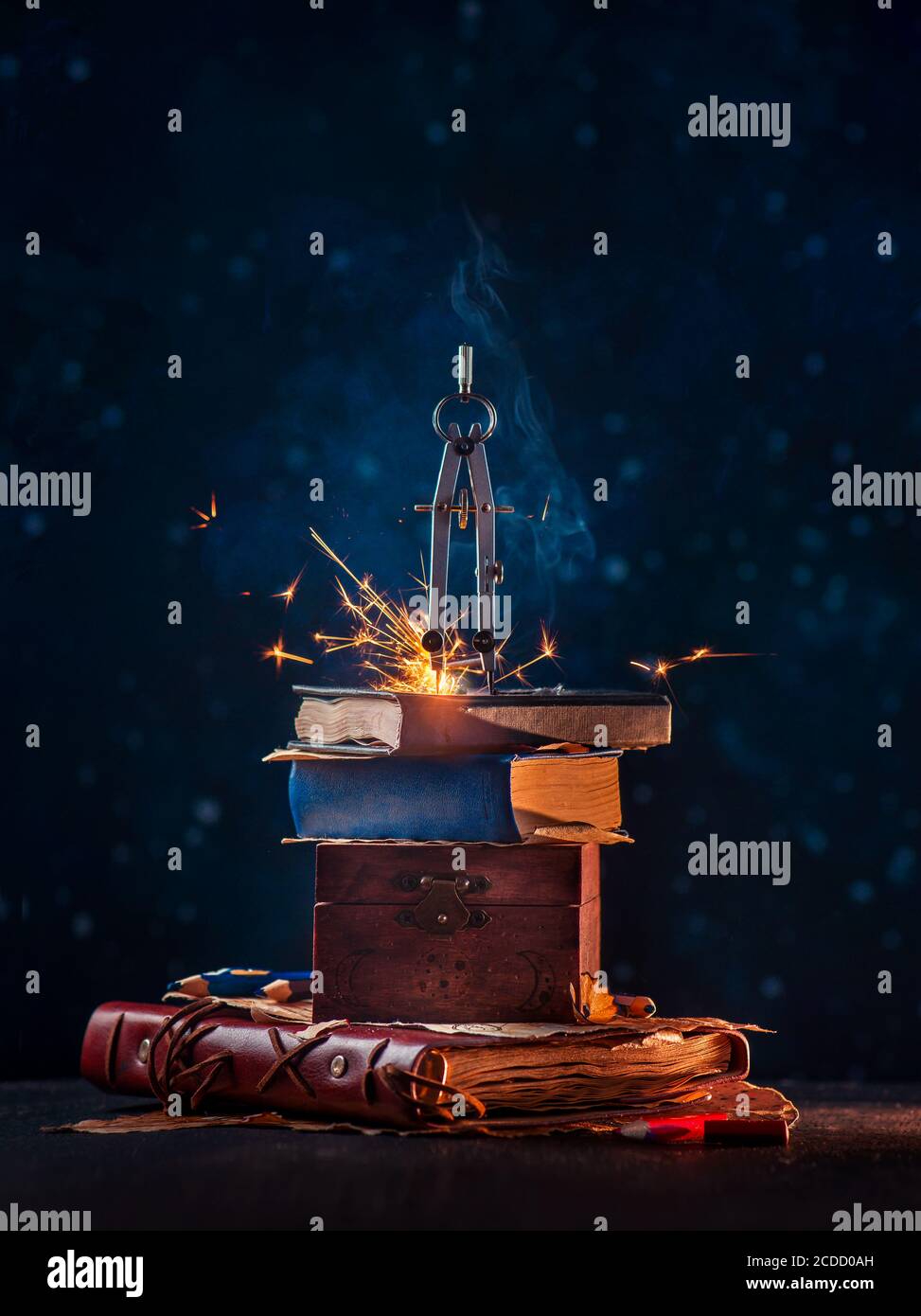 Engineering and construction idea, compasses with sparkles on a stack ...