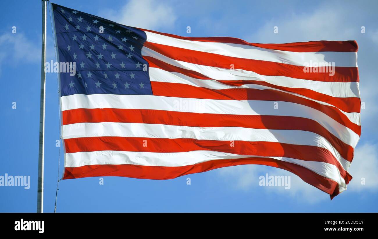 American flag flying in hi-res stock photography and images - Alamy