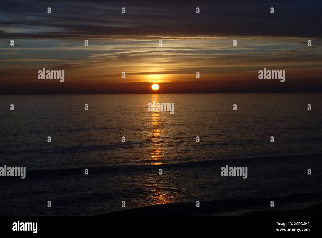sunset over the atlantic ocean Stock Photo - Alamy