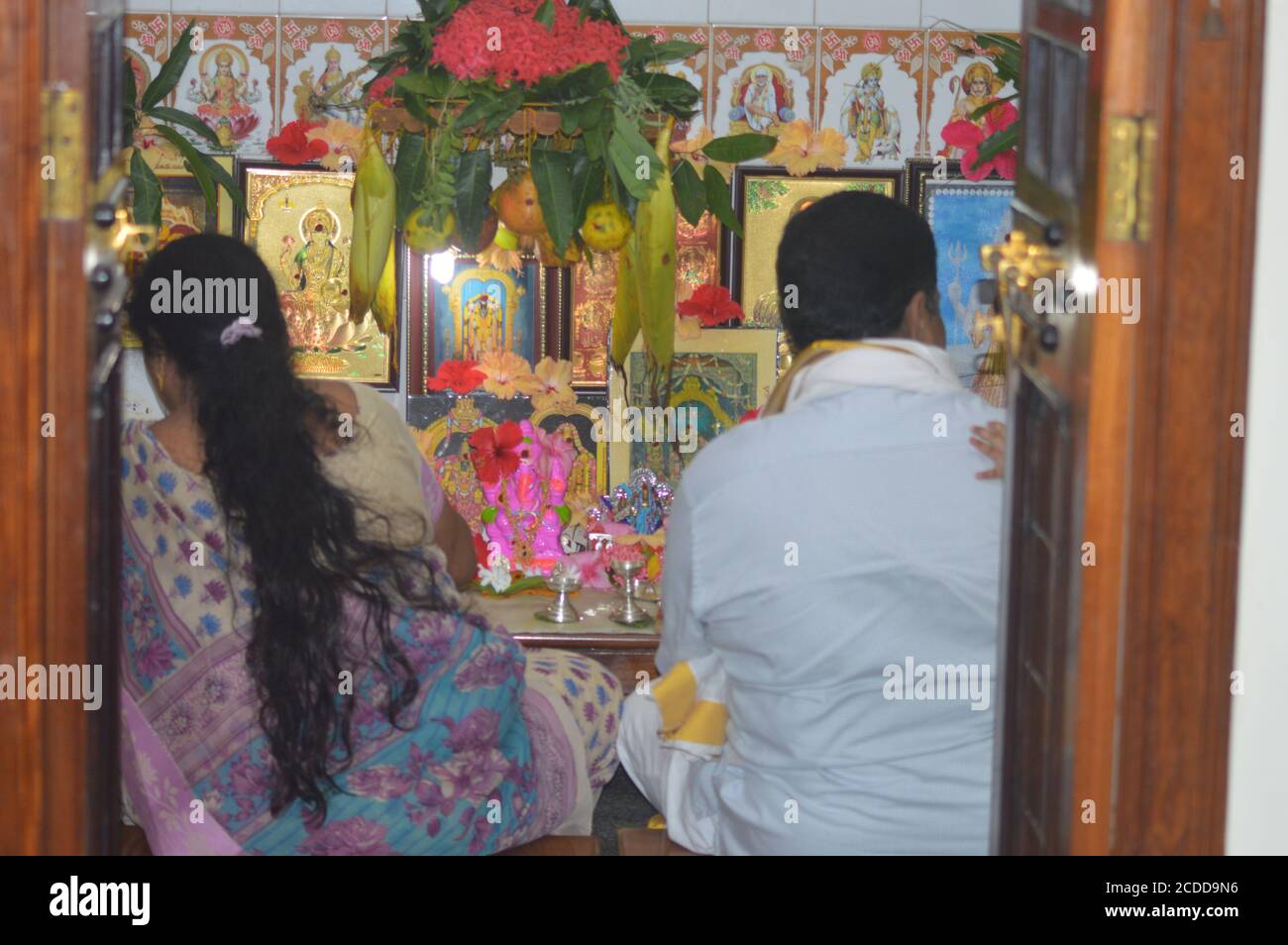 Indian Hindu family worshipping God on the festival day with all family ...